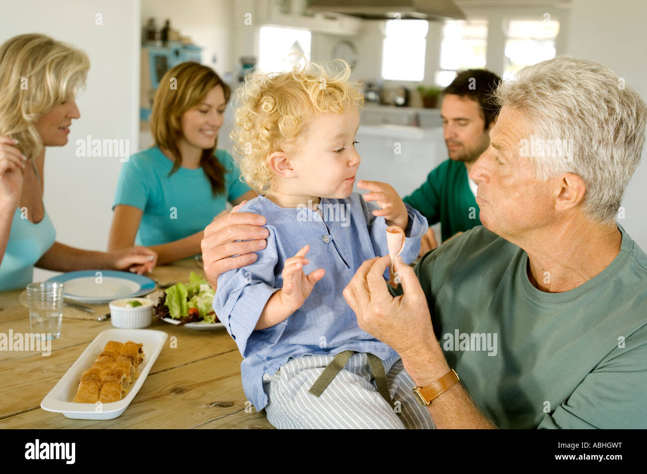 Family at home Stock Photo - Alamy