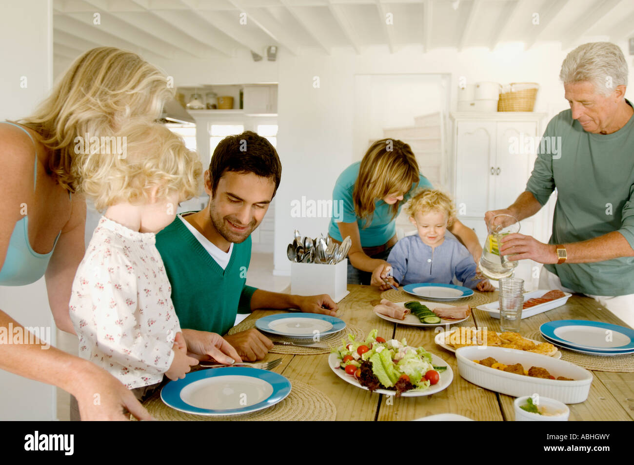 Family at home Stock Photo - Alamy