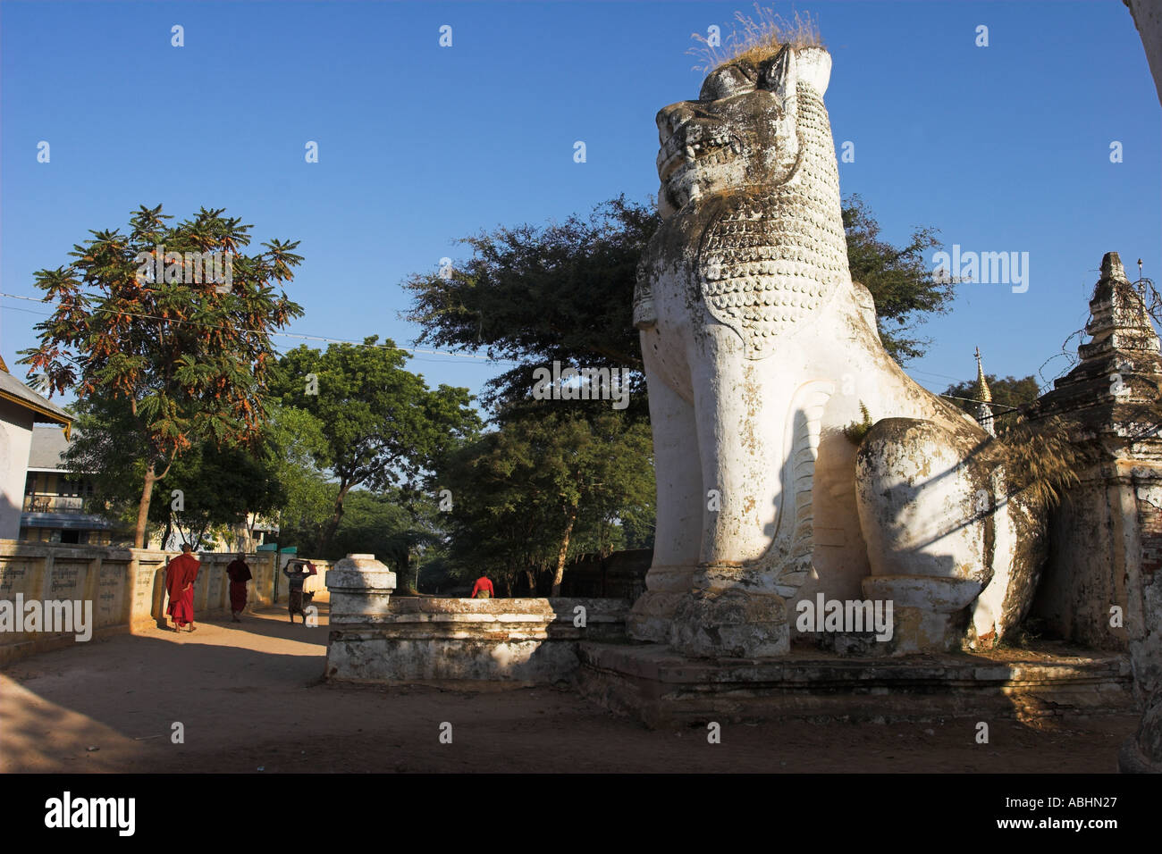 Myanmar Bagan Stone lion standing at rear entrance to Shwezigon Paya ...