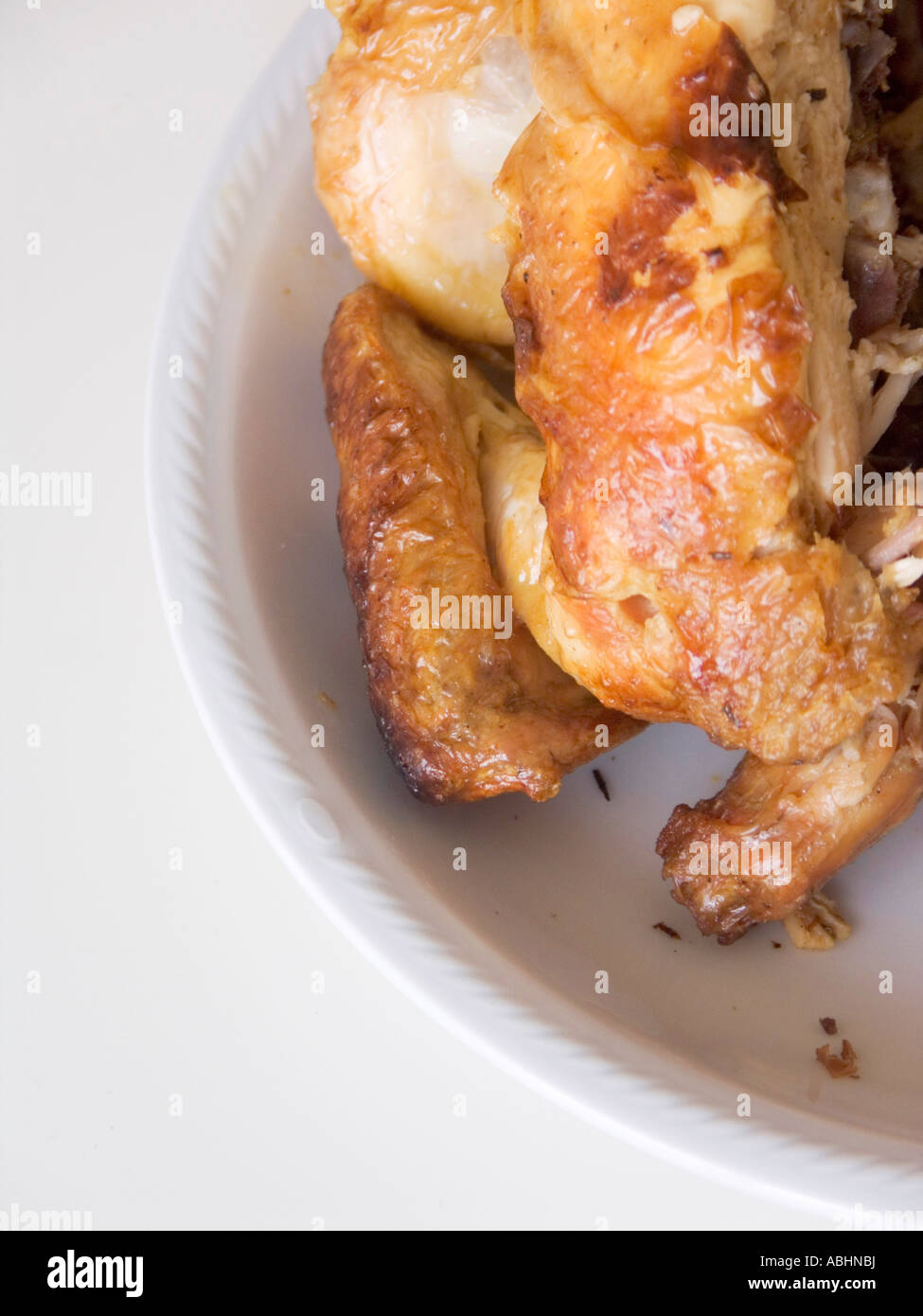 roasted chicken close up on a white background Stock Photo - Alamy