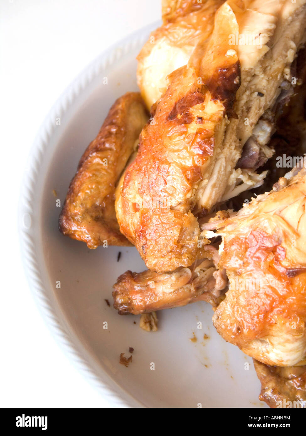 roasted chicken close up on a white background Stock Photo - Alamy
