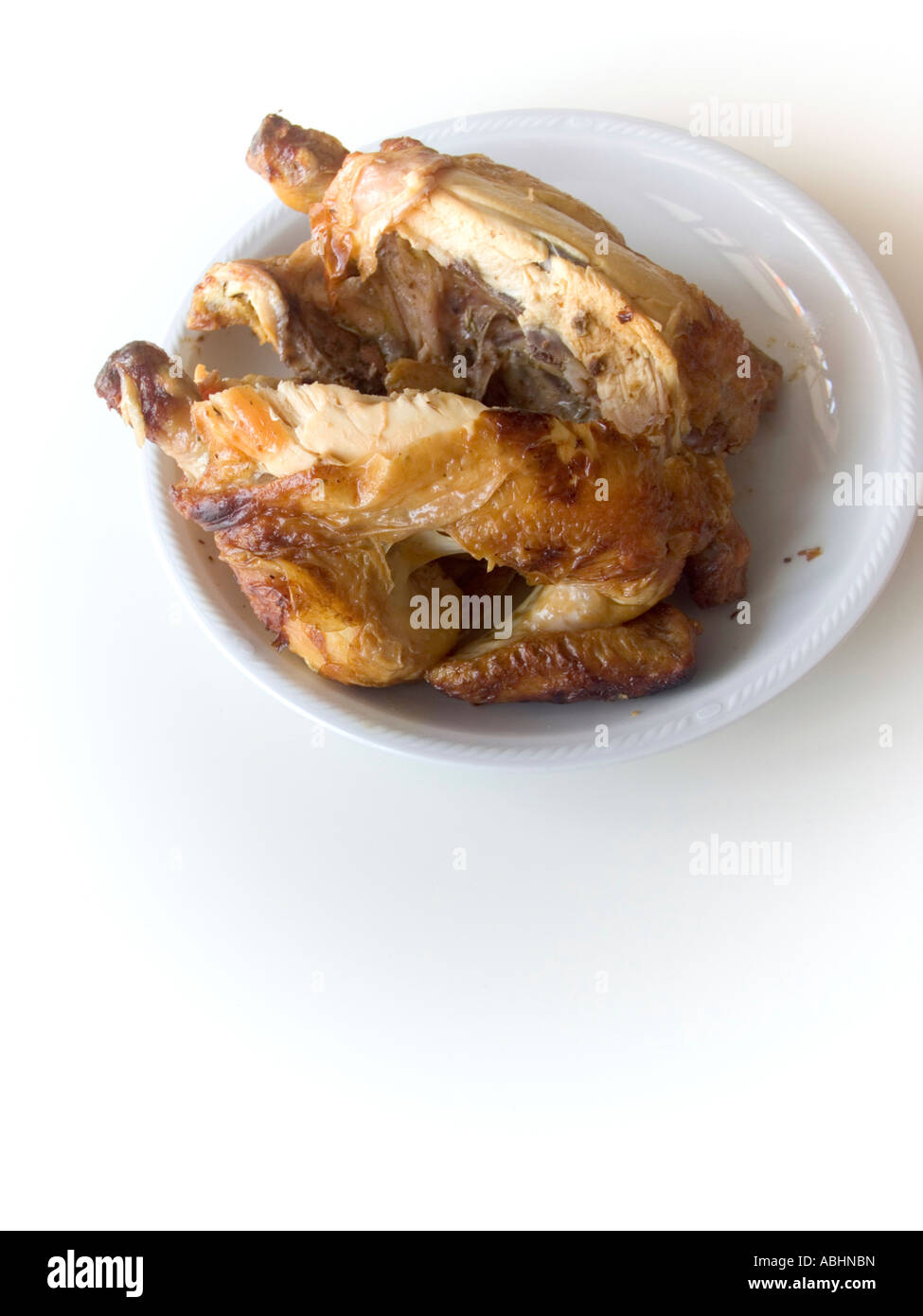 roasted chicken close up on a white background Stock Photo - Alamy