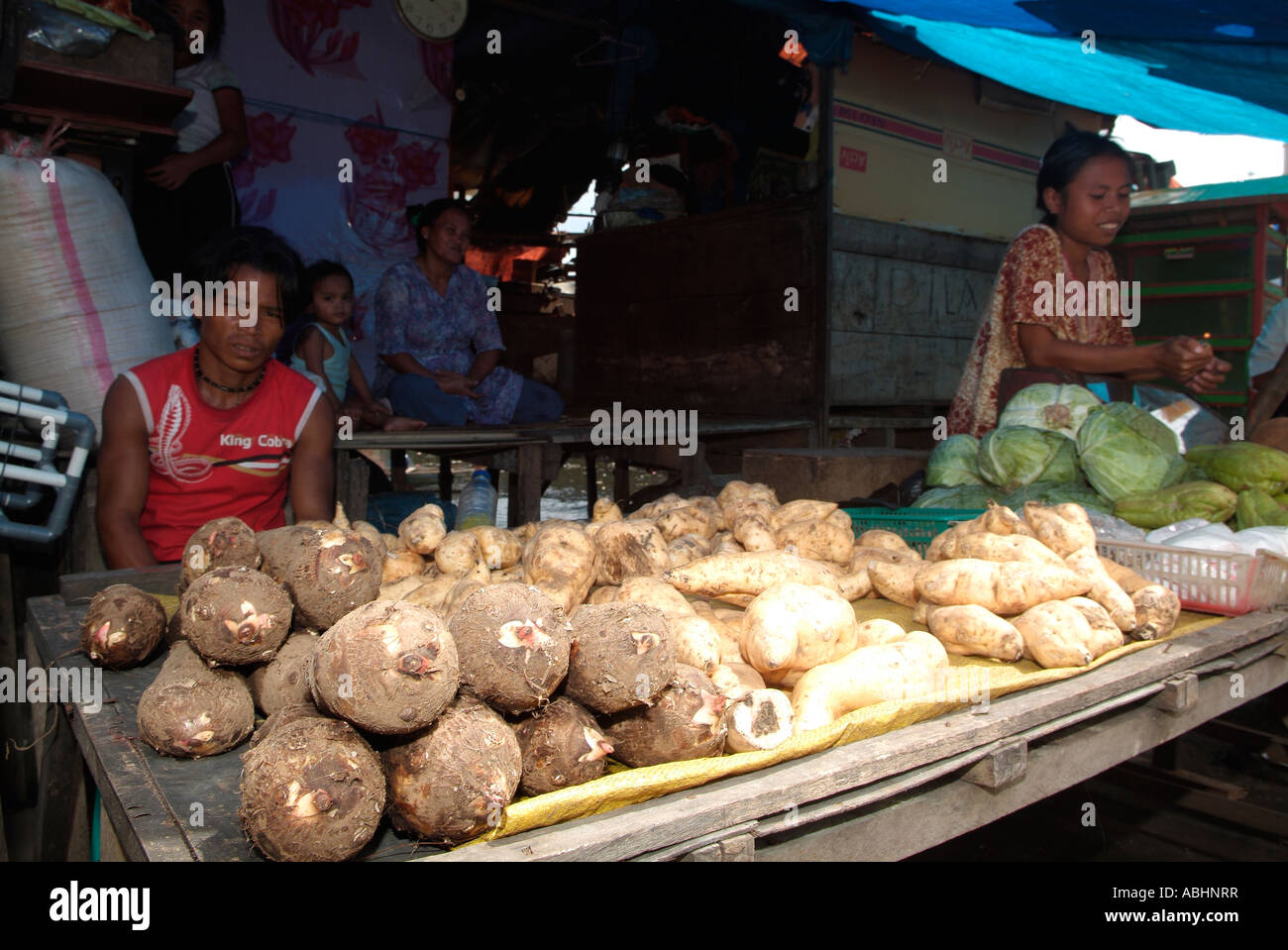Man selling vegetables in a market in Manado, North Sulawesi Stock ...