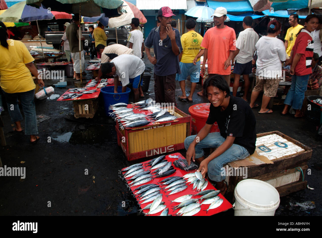 Man selling fish, local market in Manado, North Sulawesi Stock Photo ...