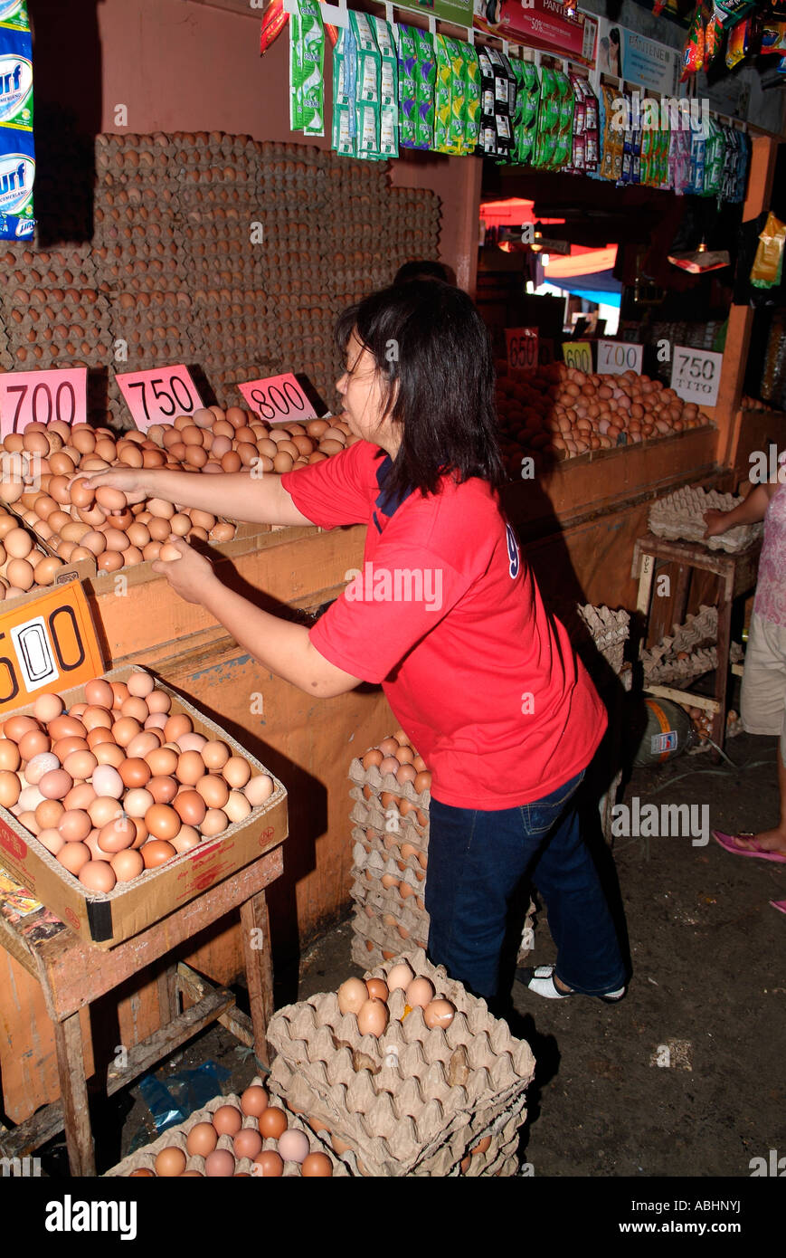 Woman selling eggs, local market in Manado, North Sulawesi Stock Photo ...