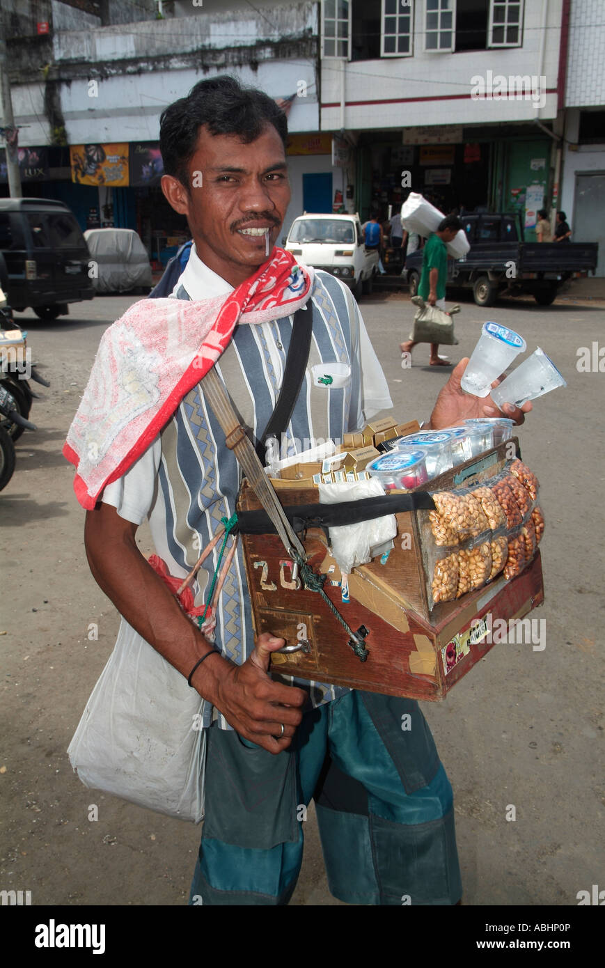 Man selling water, local market in Manado, North Sulawesi Stock Photo ...