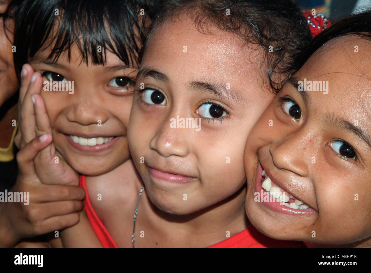 Portrait of kids playing in Manado, North Sulawesi Stock Photo - Alamy