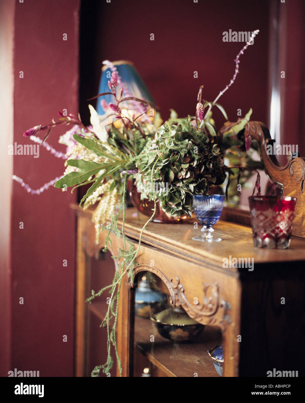 flower arrangement vase on display chest Stock Photo - Alamy