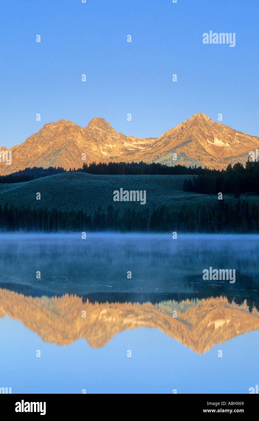 Little Redfish Lake reflects the Sawtooth Mountain Range at surise in ...