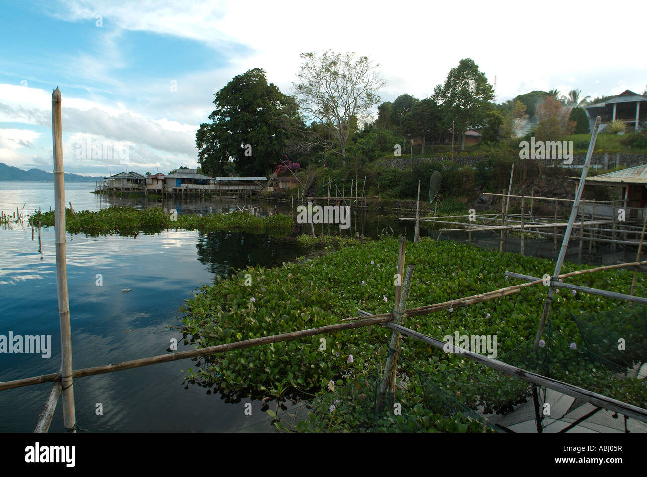 Pile houses built on a lake near Manado, Indonesia Stock Photo - Alamy