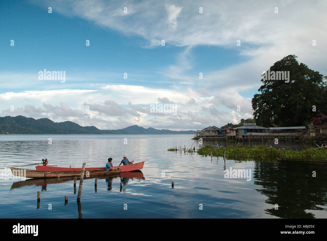 Pile houses built on a lake near Manado, Indonesia Stock Photo - Alamy