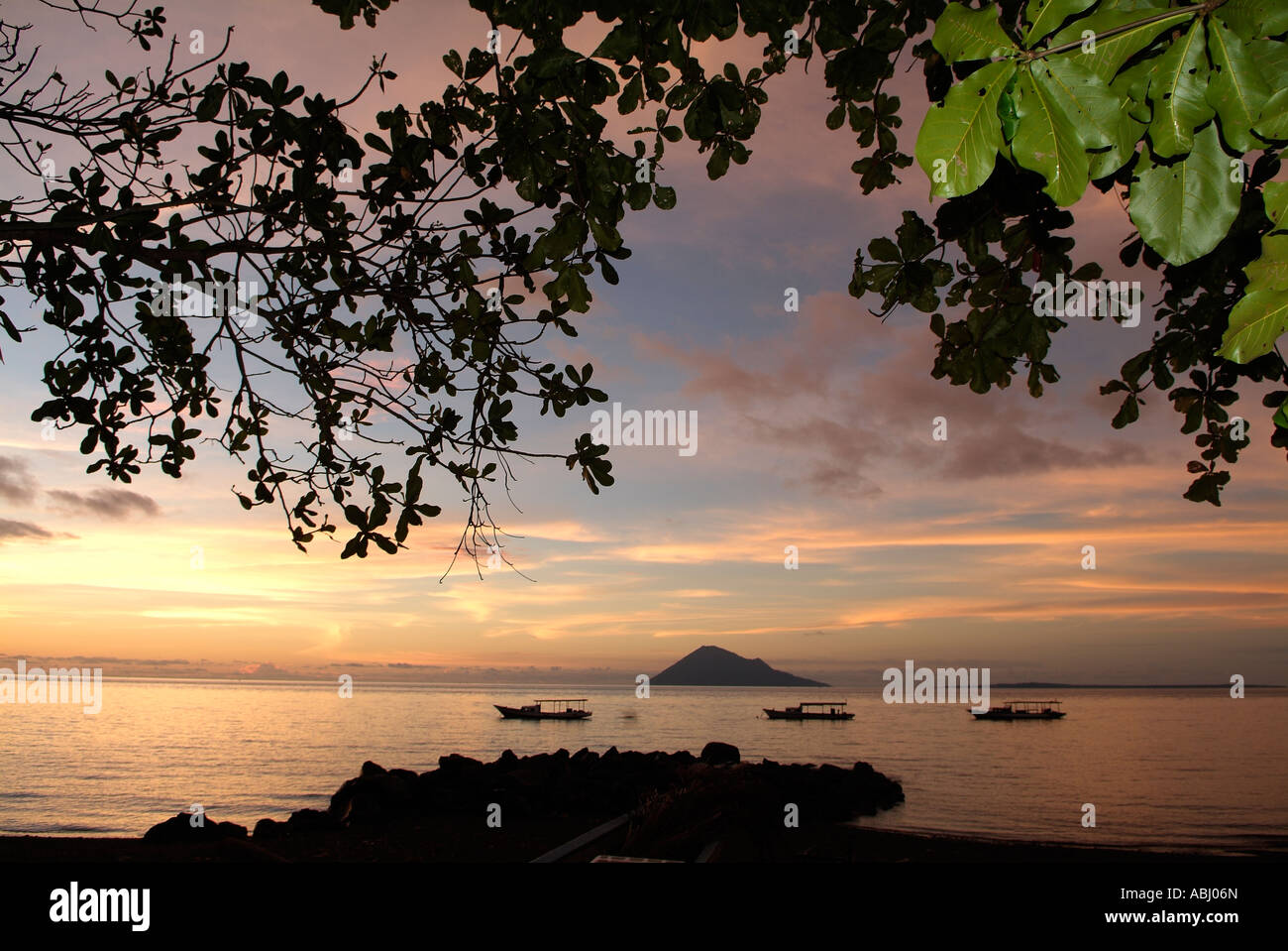 Sunset over the extinct Manado Tua volcano, North Sulawesi Stock Photo ...