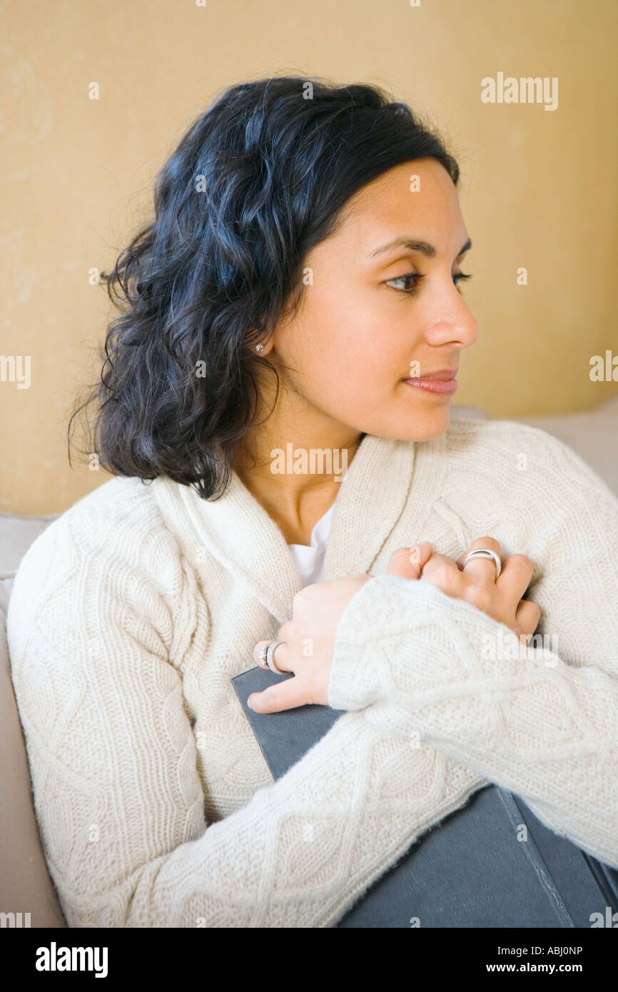 Portrait of reflective young woman Stock Photo - Alamy