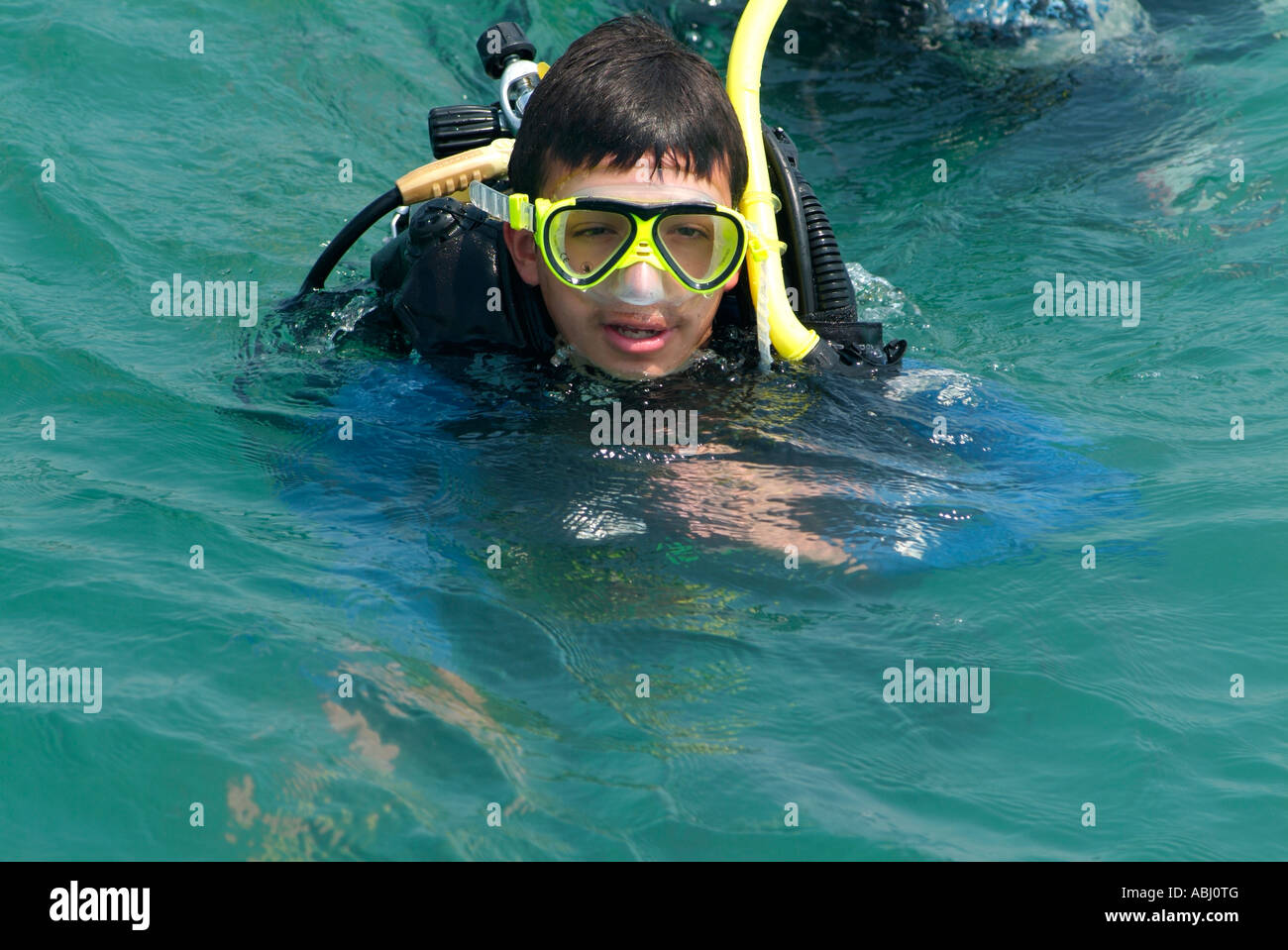 A teenager learning to dive in the ocean Stock Photo - Alamy