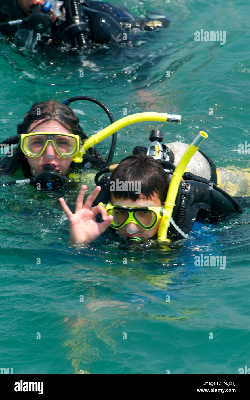 A teenager learning to dive in the ocean Stock Photo - Alamy