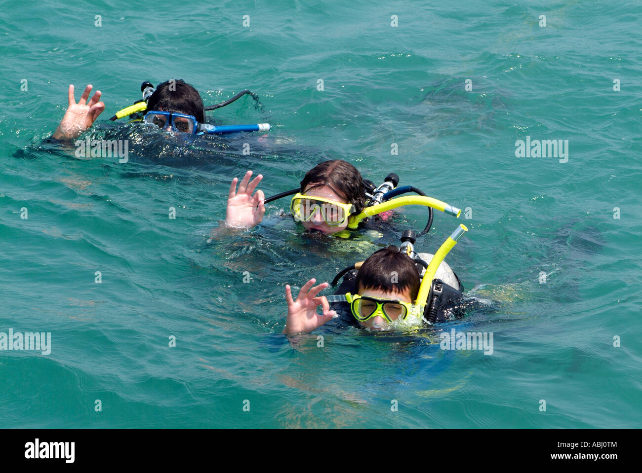 Teenagers learning to dive in the ocean Stock Photo - Alamy