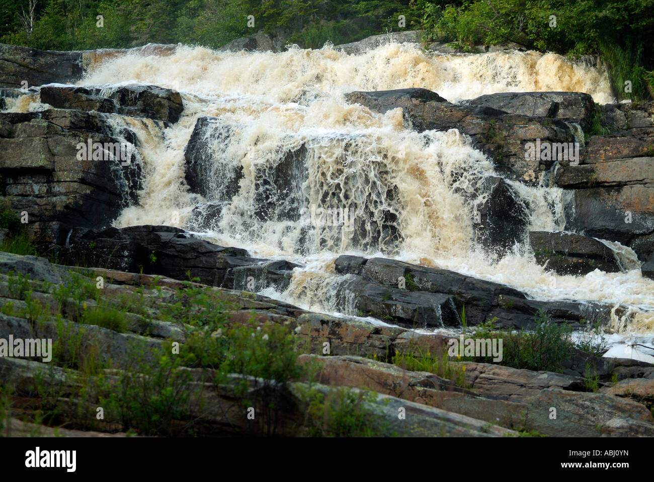 Stream Cascading over rocks in Baie Comeau, Quebec Stock Photo - Alamy