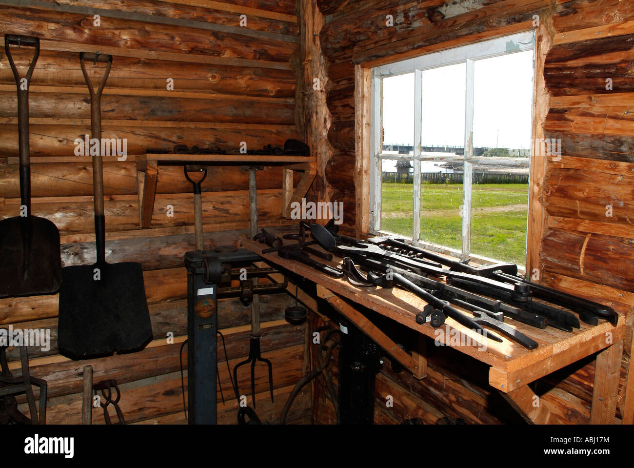 Display of shovels inside a forge, North of Quebec Stock Photo - Alamy