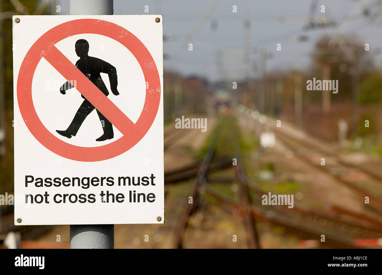 disused rail tracks with do not cross the line warning sign Stock Photo ...