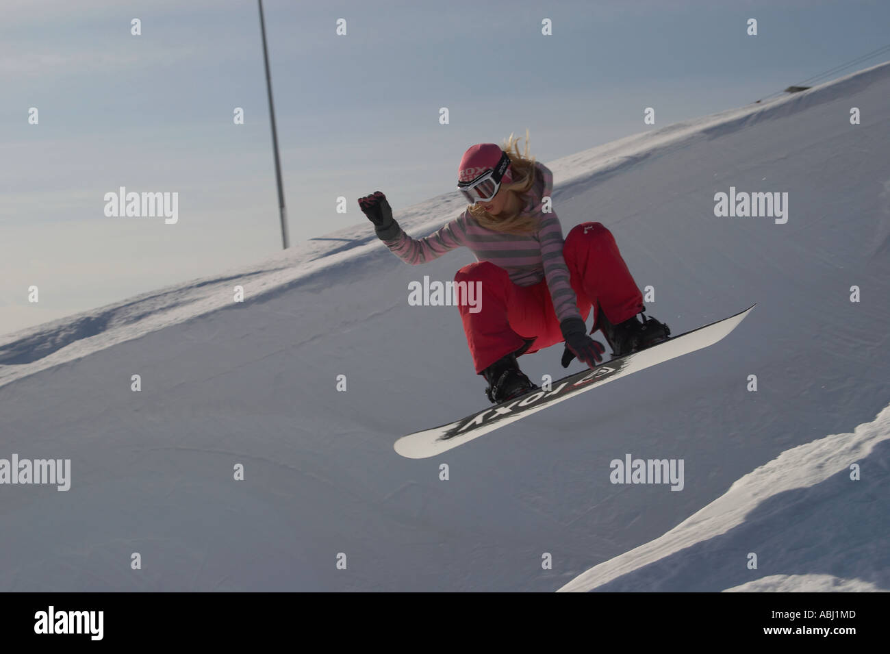 Snowboard girl and half pipe ride 10 Stock Photo - Alamy