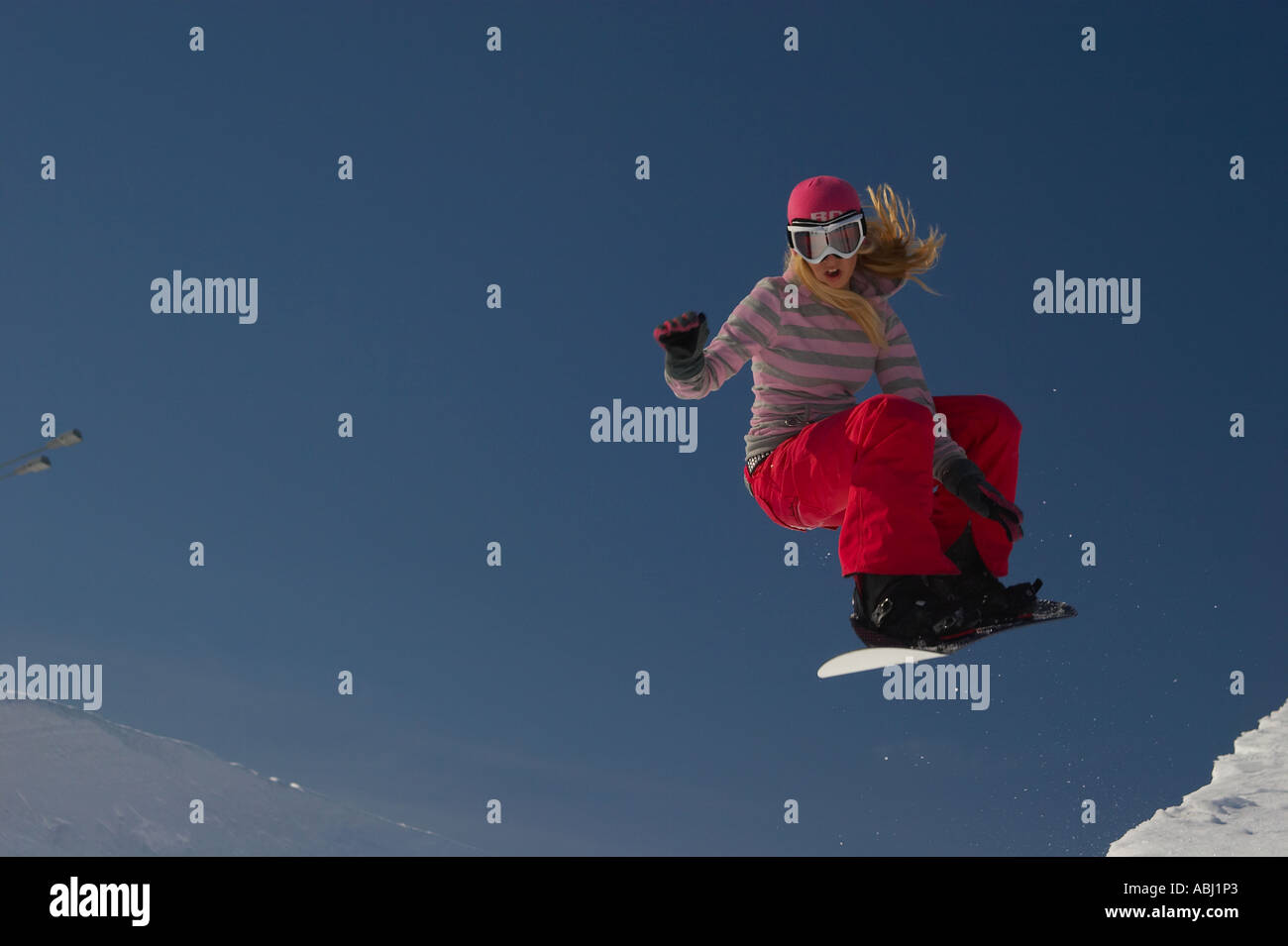 Snowboard girl and half pipe ride 8 Stock Photo - Alamy