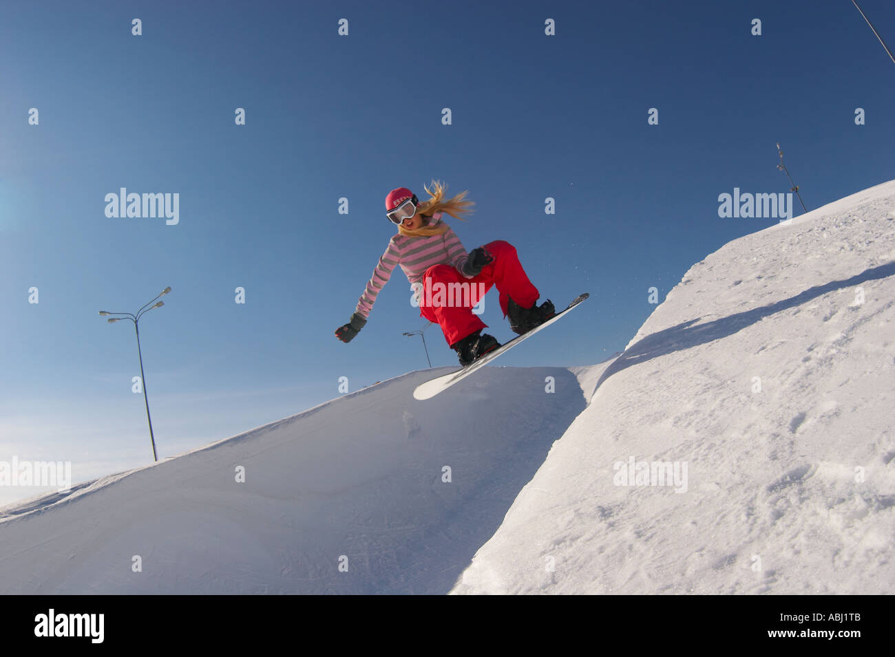 Snowboard girl and half pipe ride 5 Stock Photo - Alamy