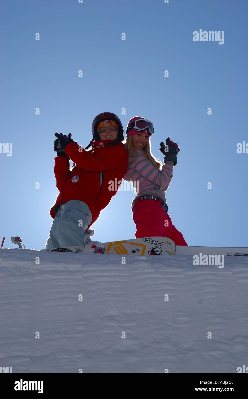 Couple of the beautiful two snowboard girls on the half pipe edge 5 ...