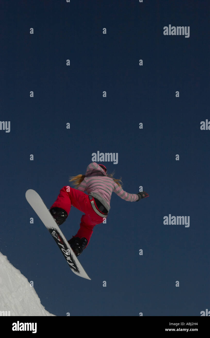 Snowboard girl and half pipe ride 1 Stock Photo - Alamy