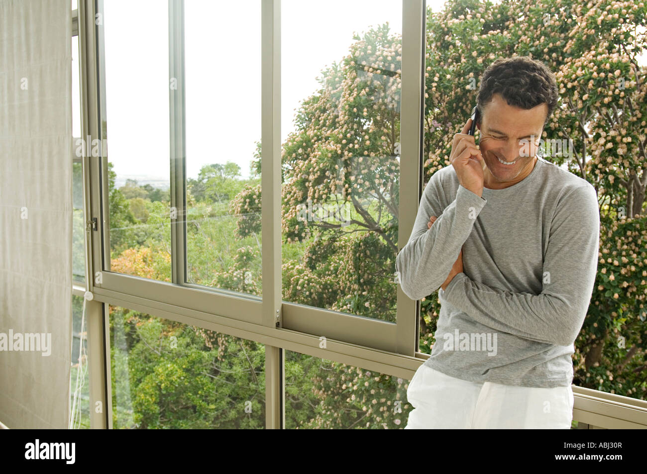 Man phoning, indoors Stock Photo - Alamy