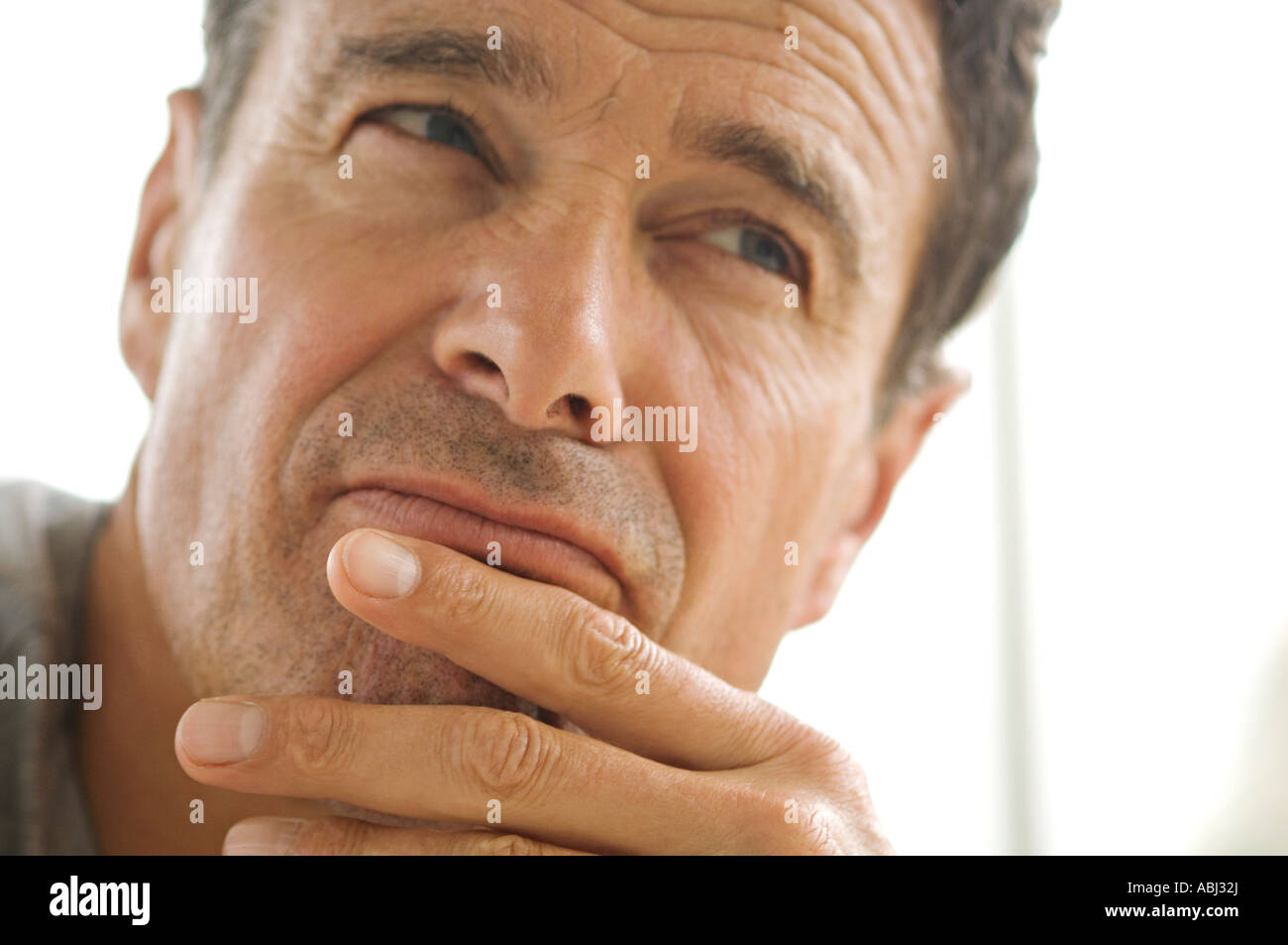Thoughtful man's portrait Stock Photo - Alamy