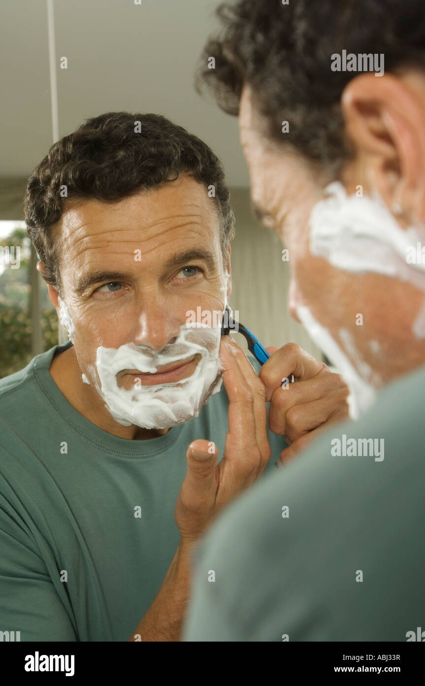 Portrait of a man shaving Stock Photo - Alamy
