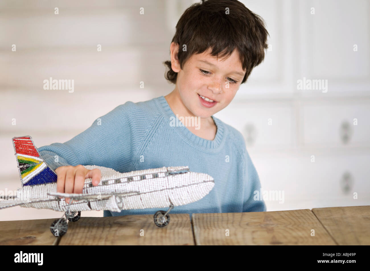 Little boy playing with model aeroplane Stock Photo - Alamy
