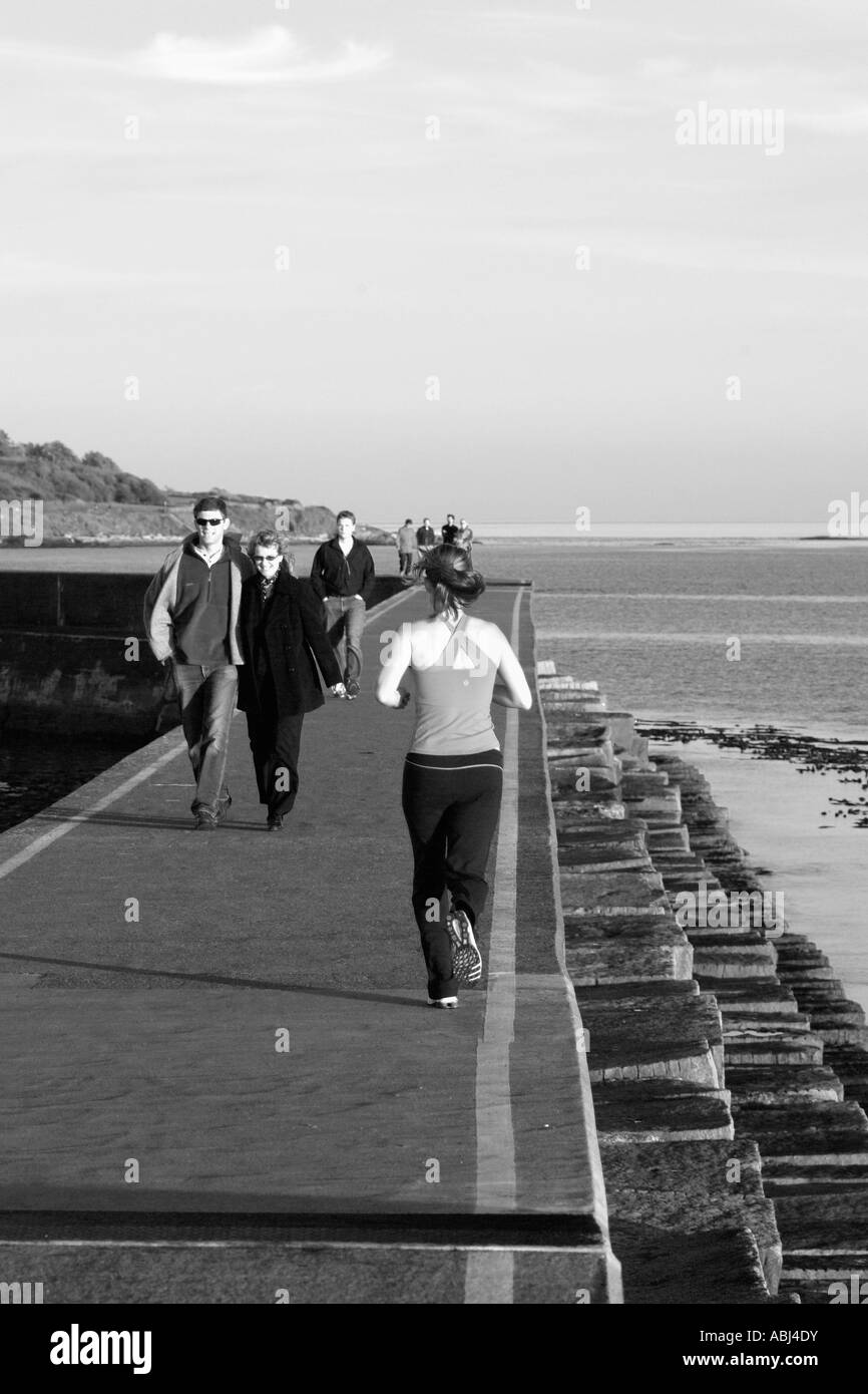 People walking running in Black and White Stock Photos & Images - Alamy