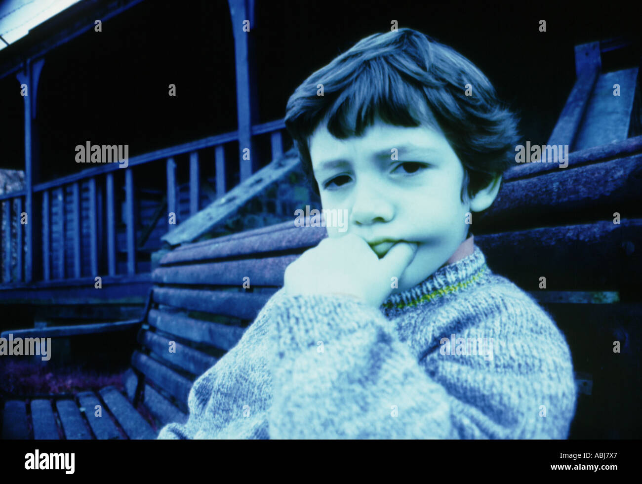 Young boy looking moody Stock Photo - Alamy