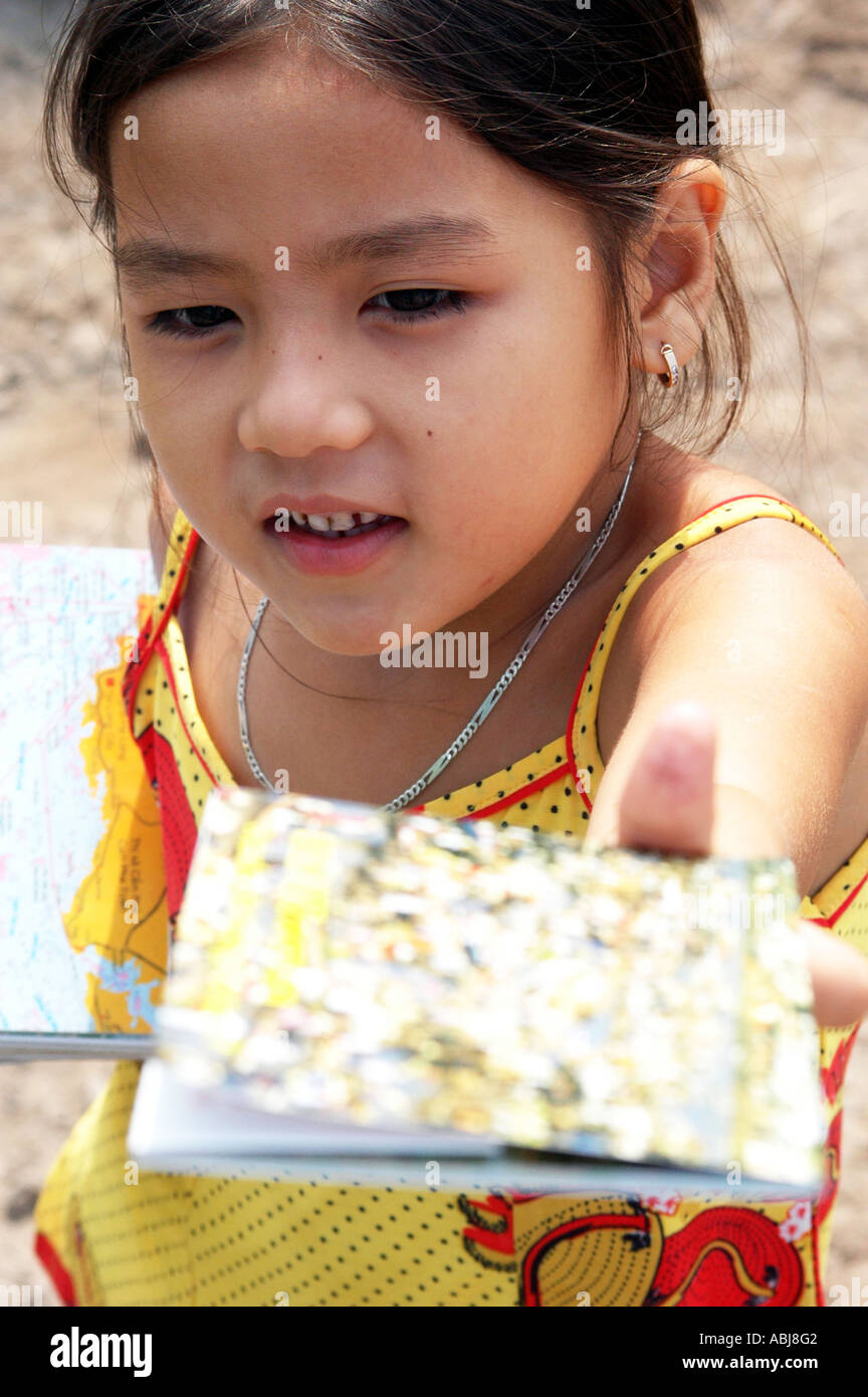 Child selling postcards hi-res stock photography and images - Alamy