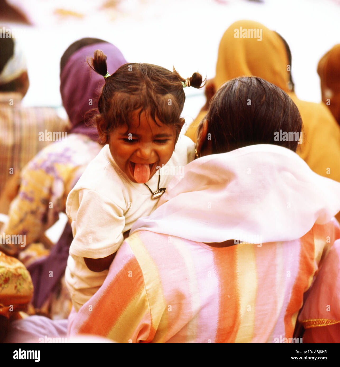 Young cheeky girl at Indian wedding ceremony Stock Photo - Alamy