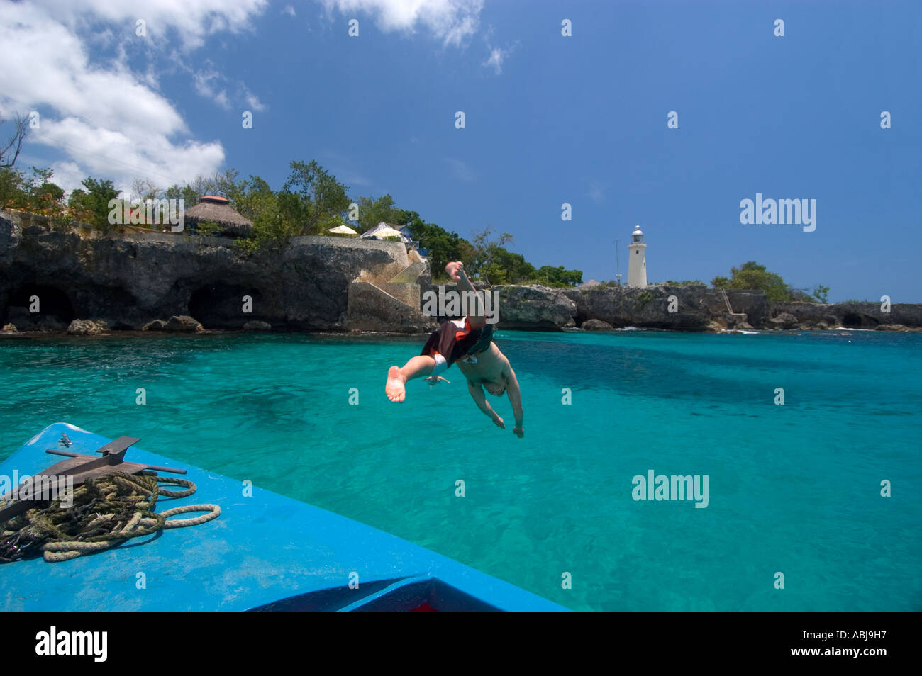 Boy diving boat hi-res stock photography and images - Alamy