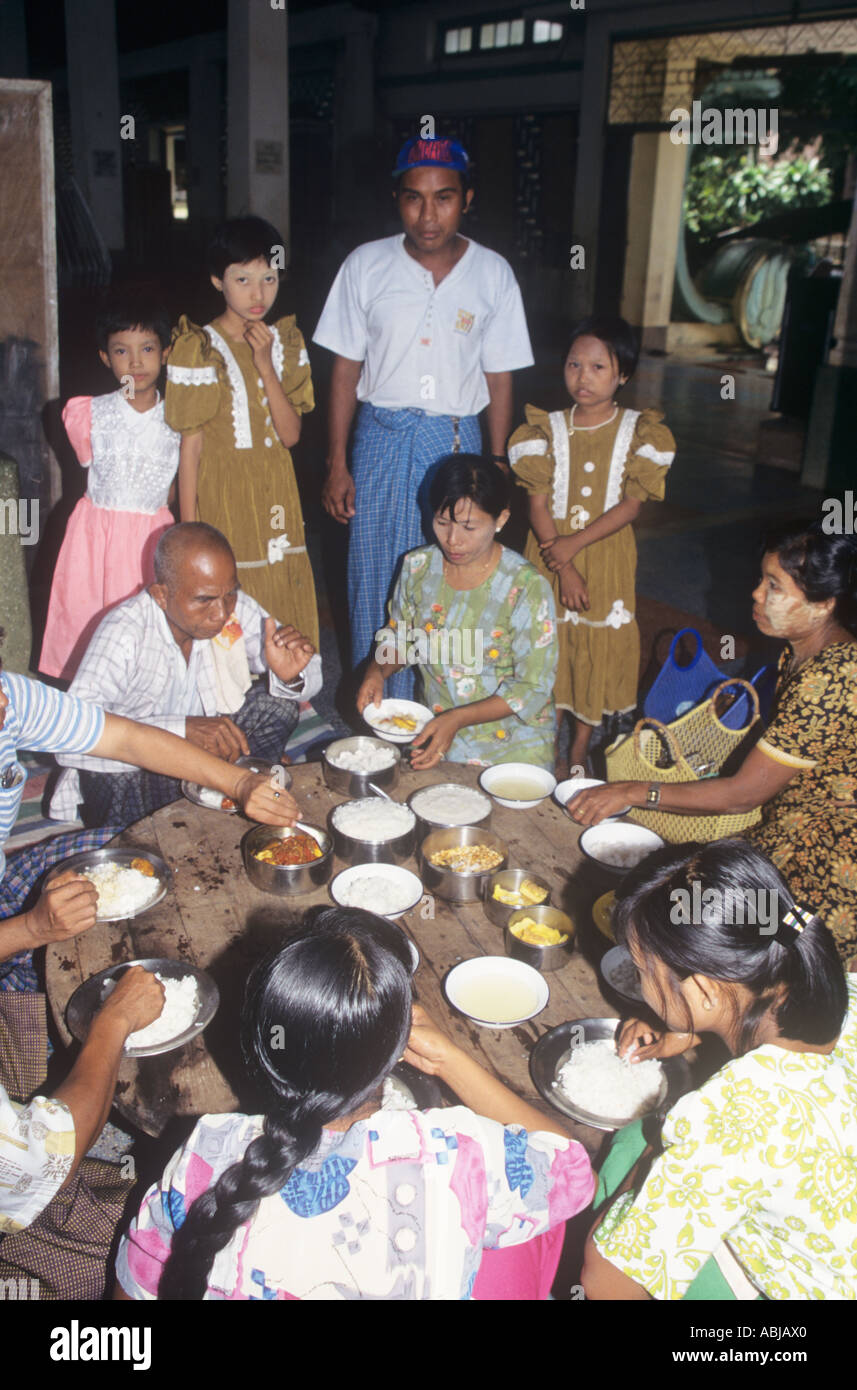 Buddhist family having lunch in a temple precincts in Burma on the ...