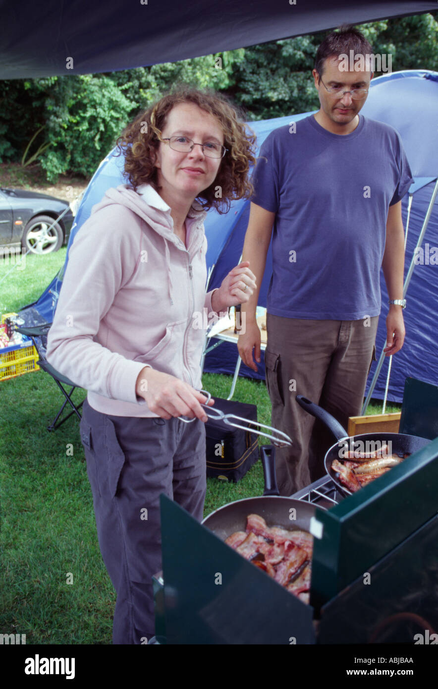 Woman frying bacon hi-res stock photography and images - Alamy