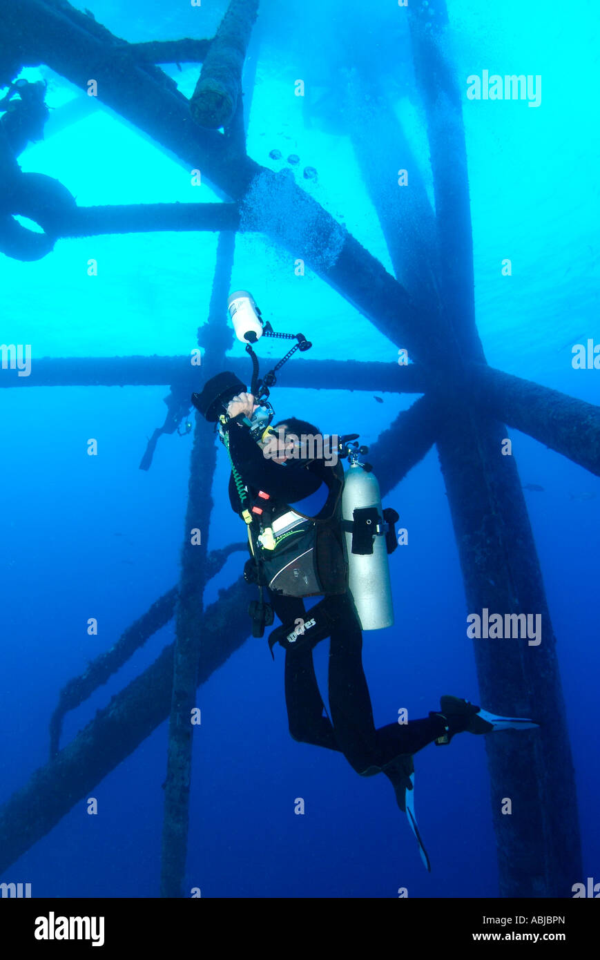 Scuba diver swimming in a rig in the Gulf of Mexico, off Texas Stock ...
