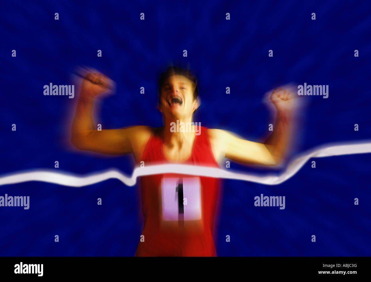 Runner winning a race and hitting the winner's tape Stock Photo - Alamy