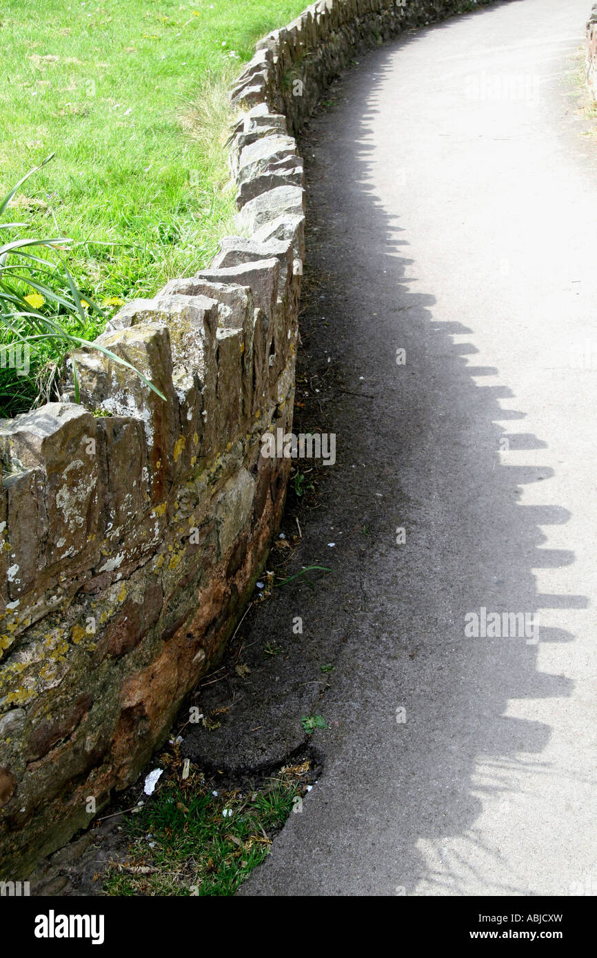 Wall, path and shadow Stock Photo - Alamy