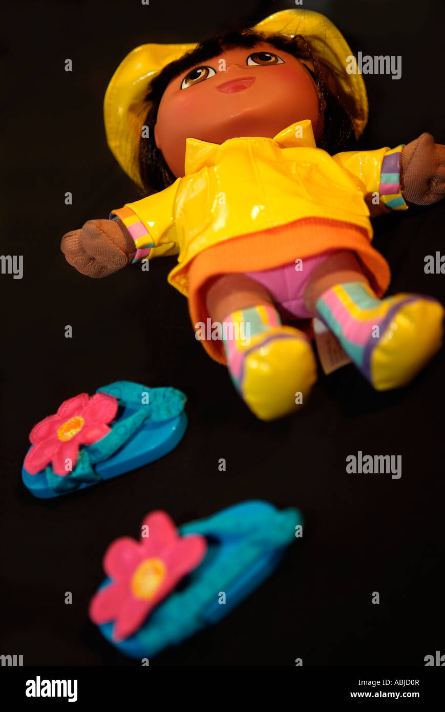 Black doll lying on the floor Stock Photo - Alamy