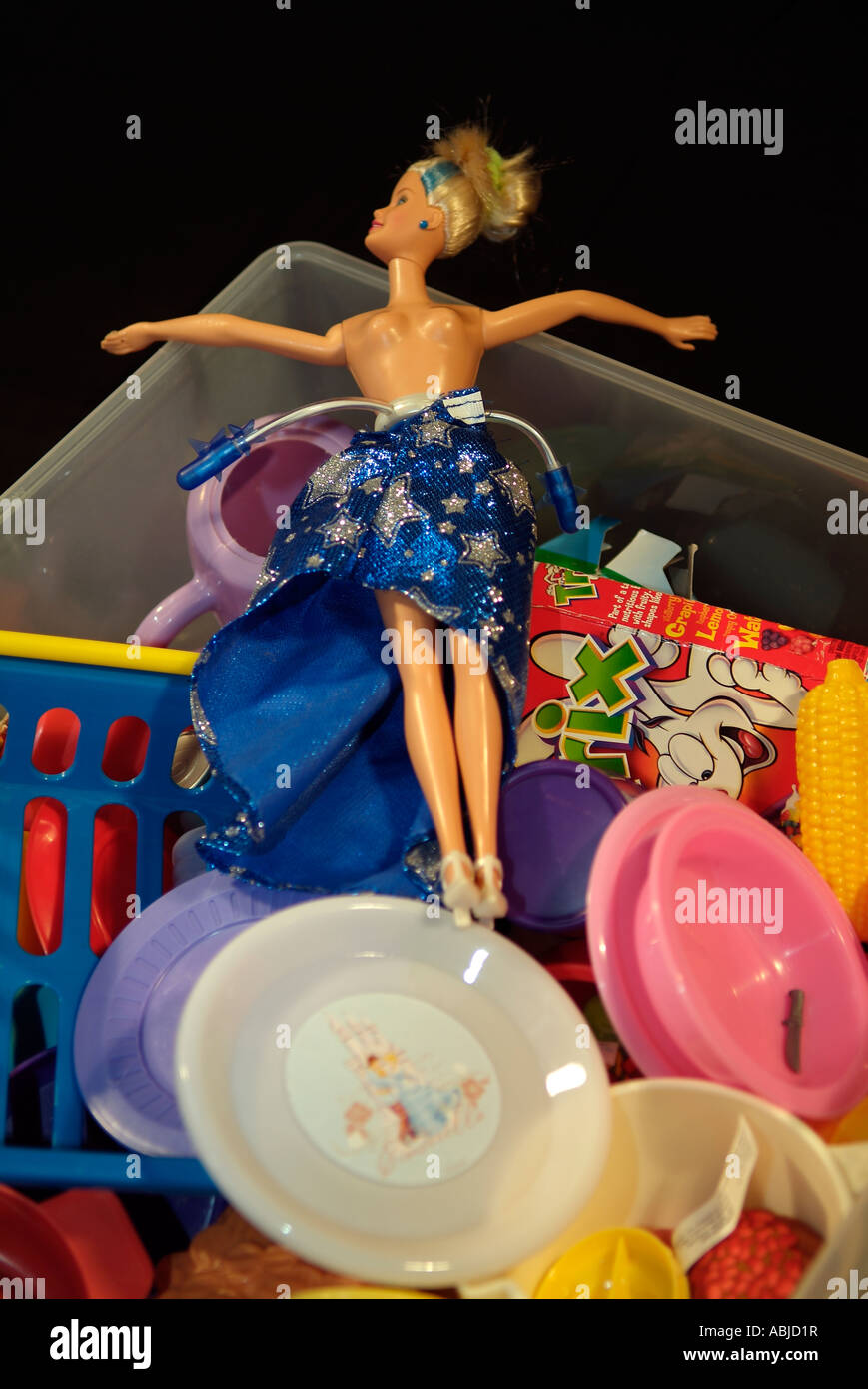 Box filling with plastic toys Stock Photo - Alamy