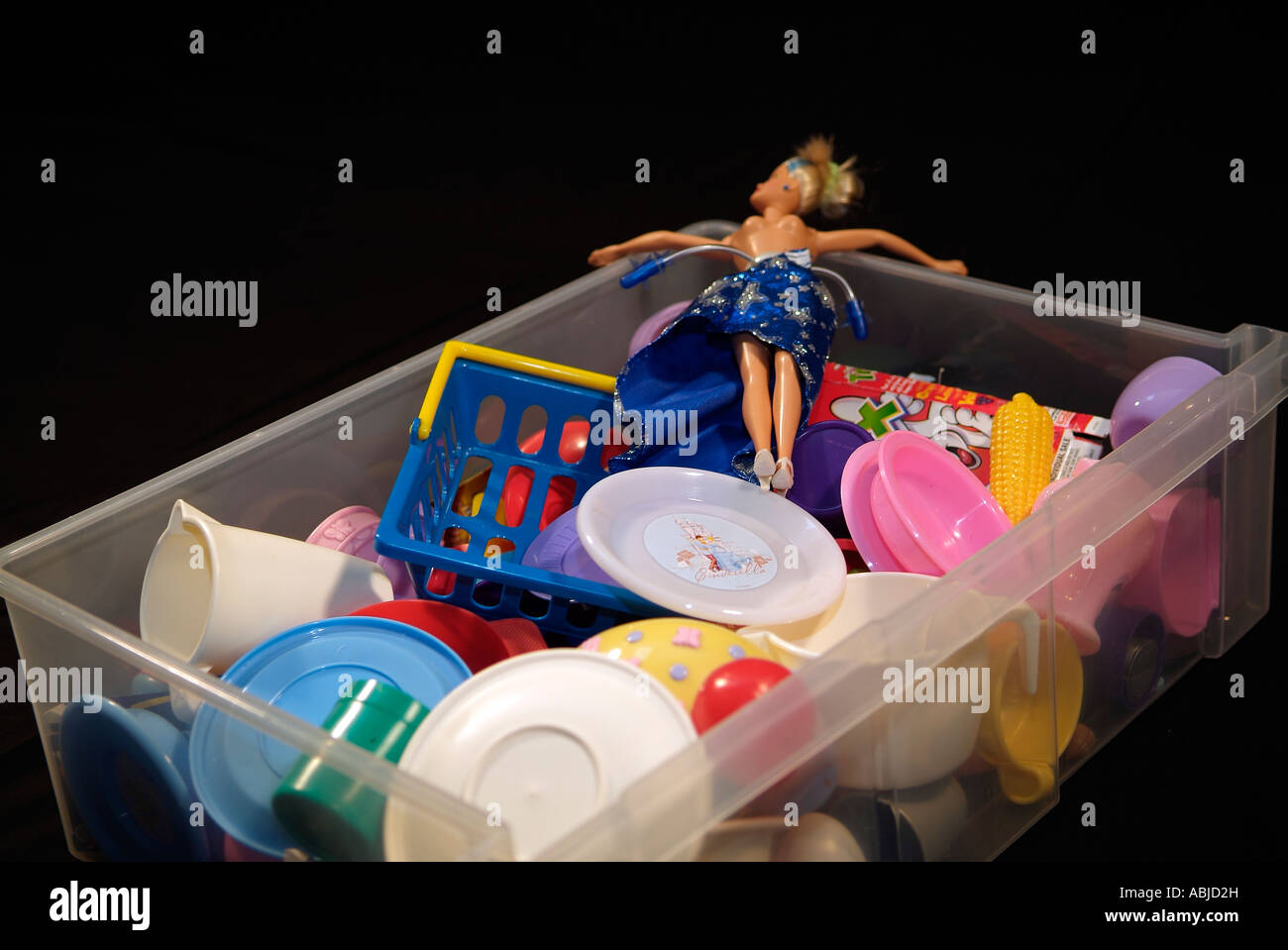 Box filling with plastic toys Stock Photo - Alamy