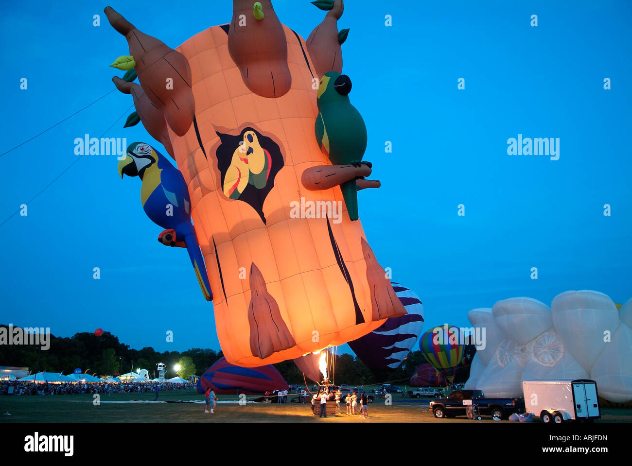 Air balloon rising in a meadow for a festival Stock Photo - Alamy
