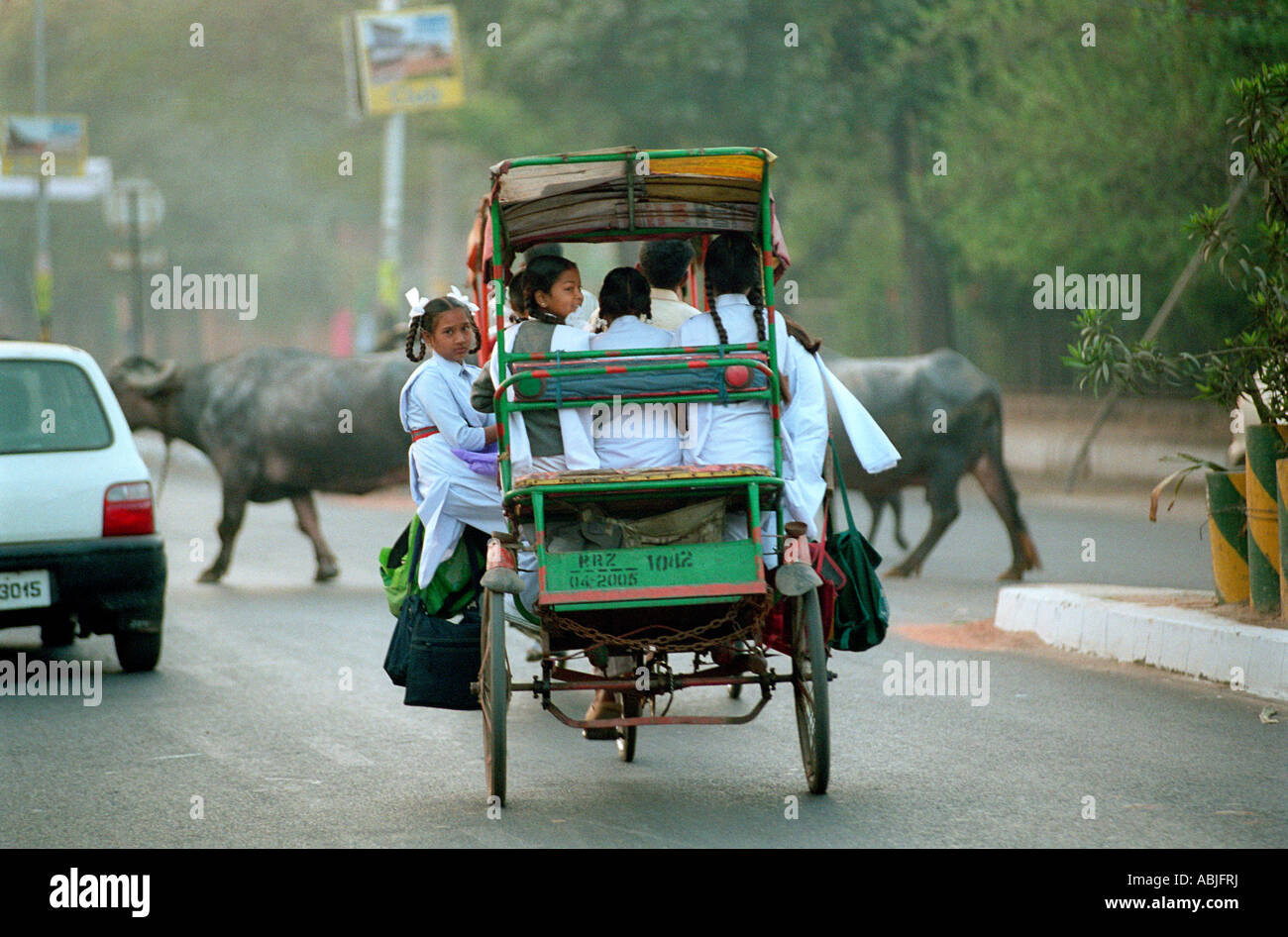 Girls travelling to school in a cycle rickshaw in India Stock Photo - Alamy
