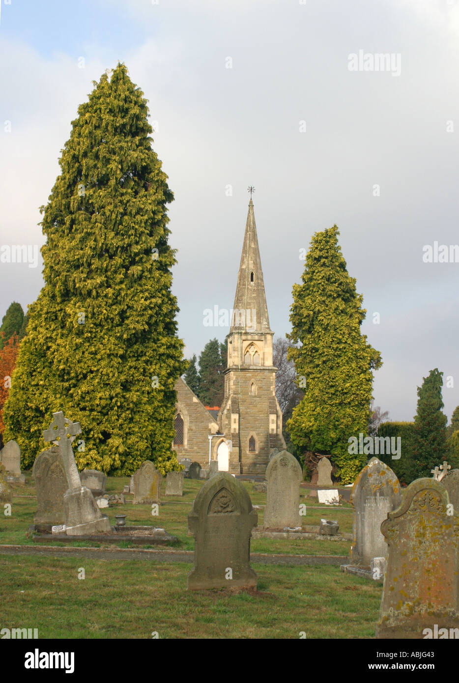 Church surrounded by graveyard Stock Photo - Alamy