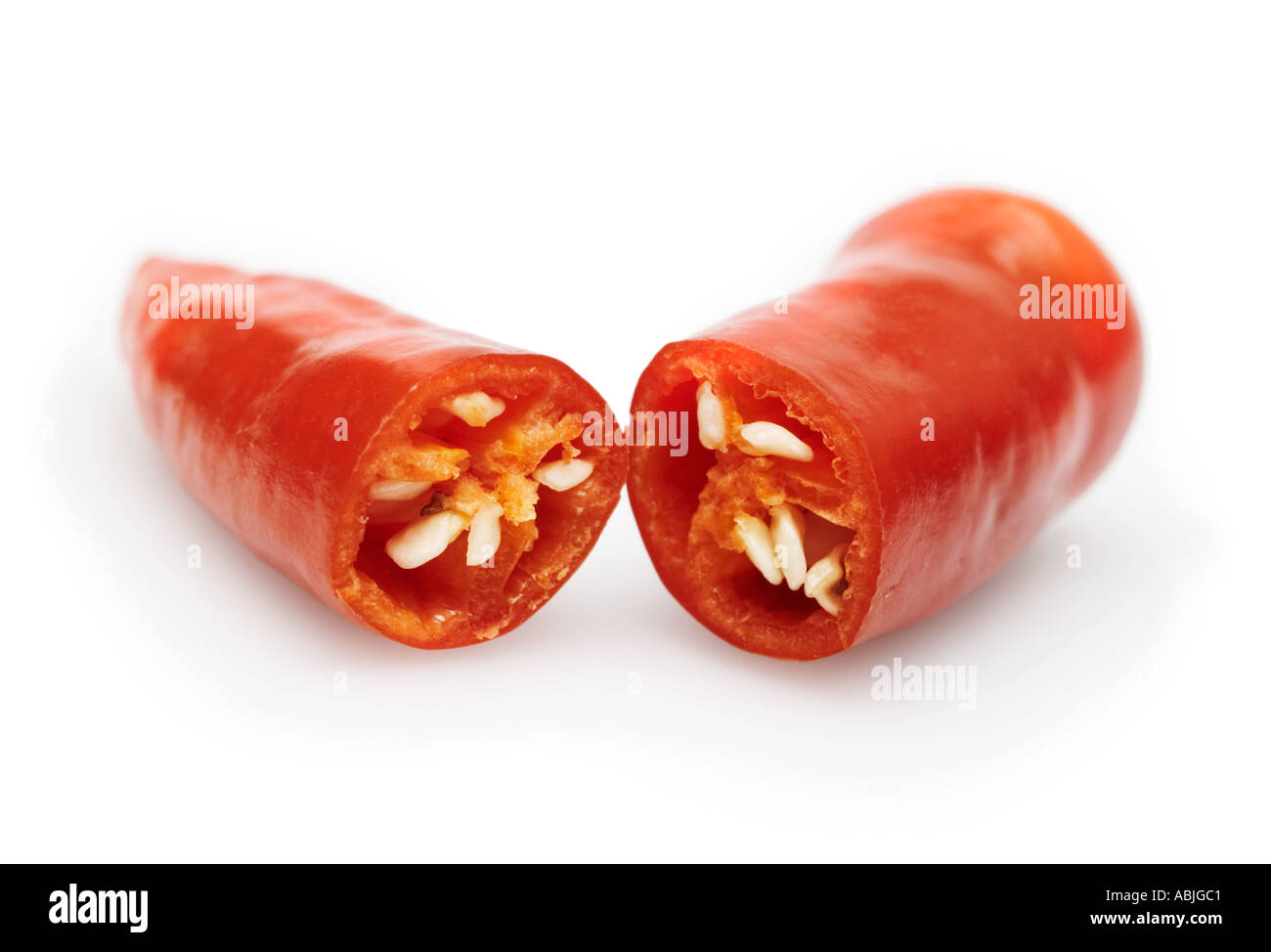 red chilli cut in half showing seeds Stock Photo - Alamy