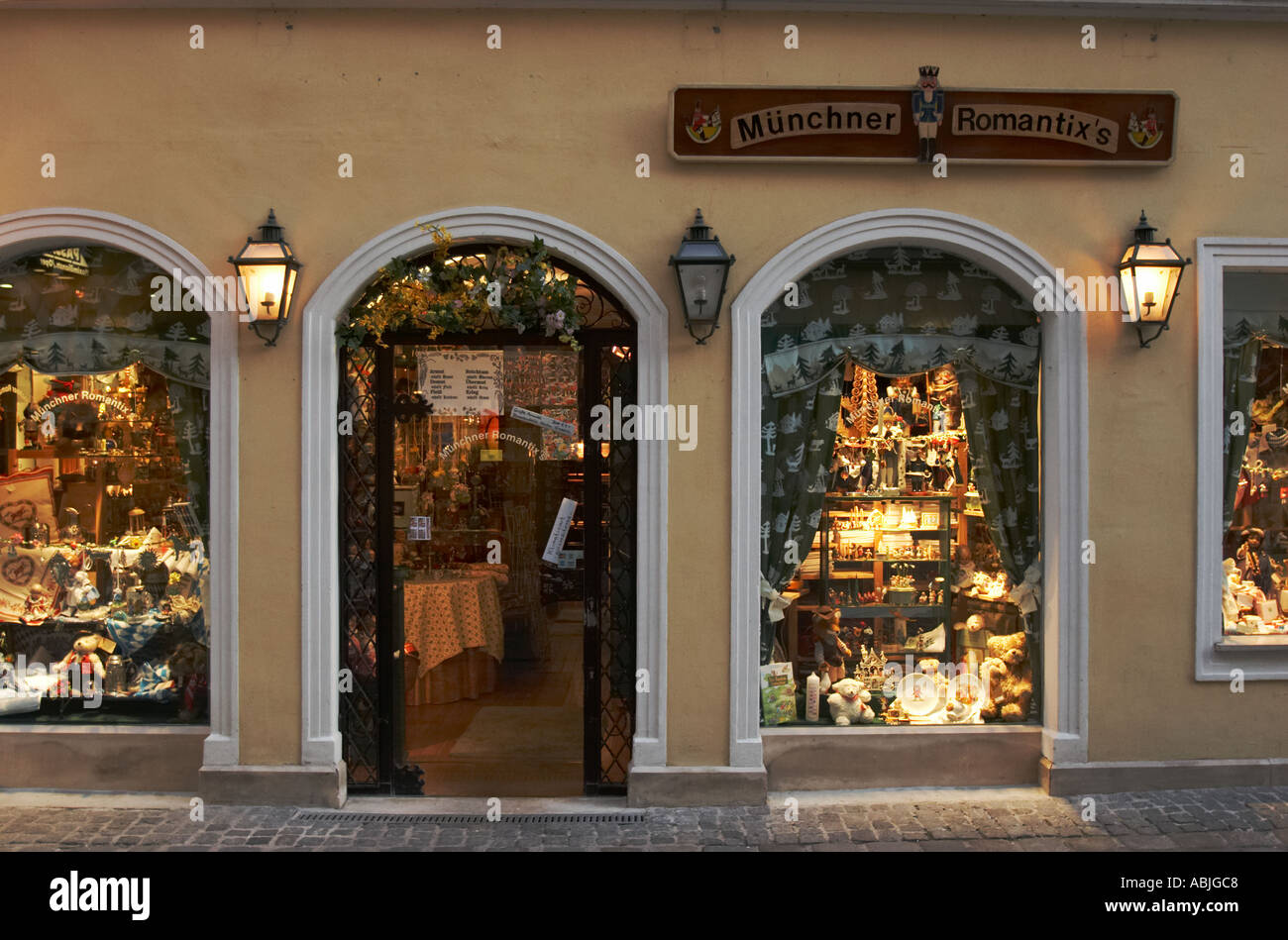 Traditional Bavarian souvenirs displayed in the illuminated windows of ...